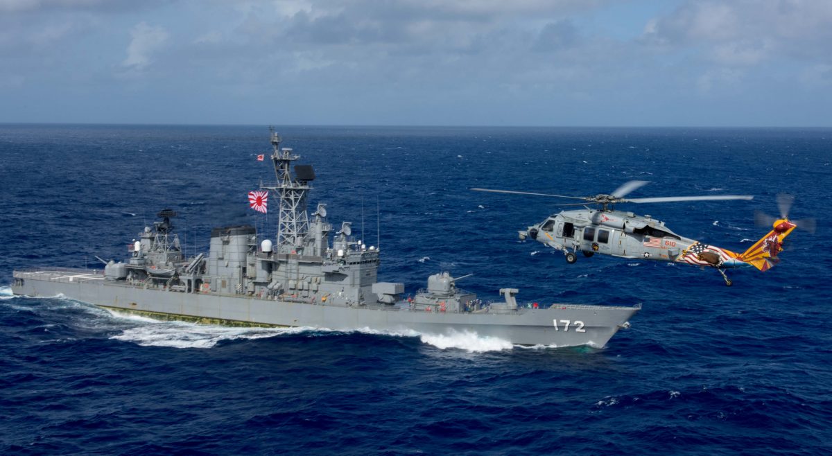 A U.S. MH-60S Sea Hawk flies by Japan's Maritime Self-Defense Force ...